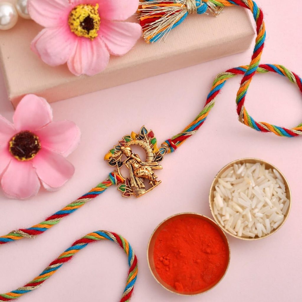 Designer Lord Krishna Rakhi With Roli Chaawal